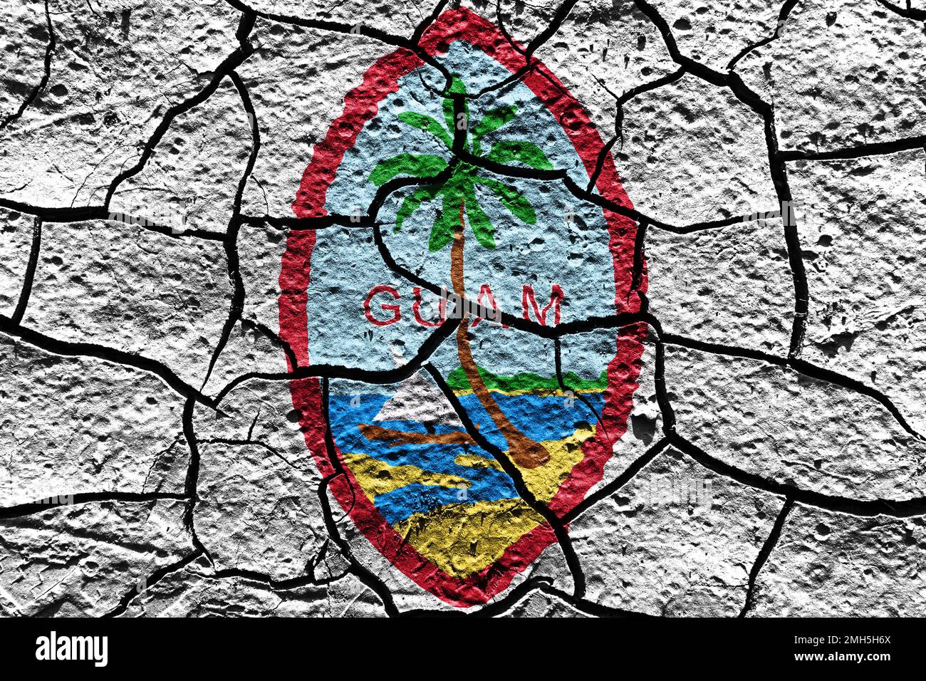 Guam state Seal flag of United States on a mud texture of dry crack on ...