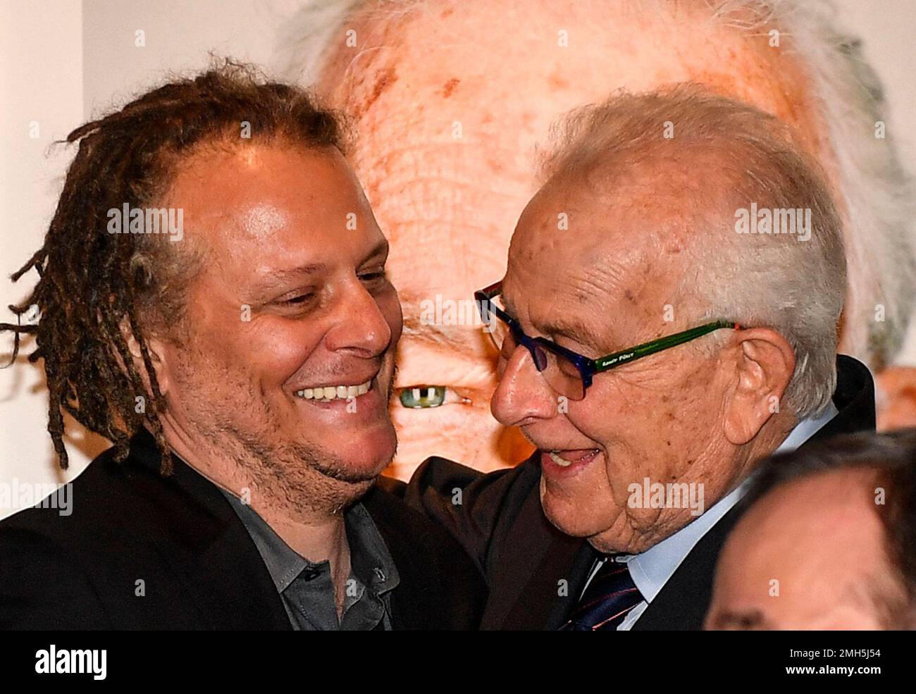Holocaust survivor Naftali Furst, right, is embraced by photographer ...