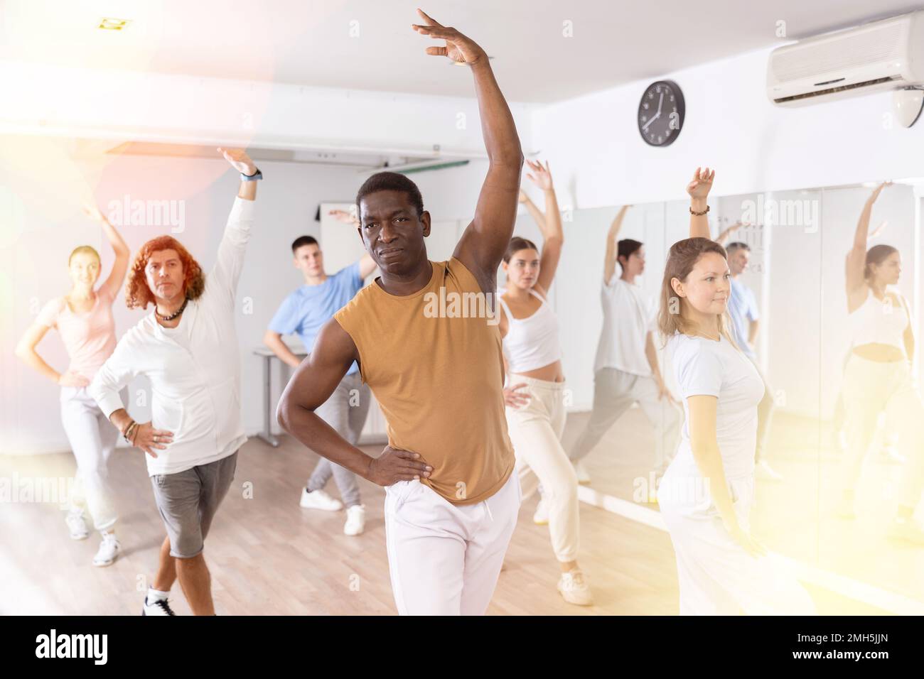 African american man practicing active dance moves during rehearsal ...