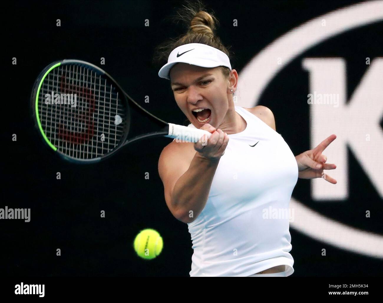 Romania's Simona Halep makes a forehand return to Jennifer Brady of the ...