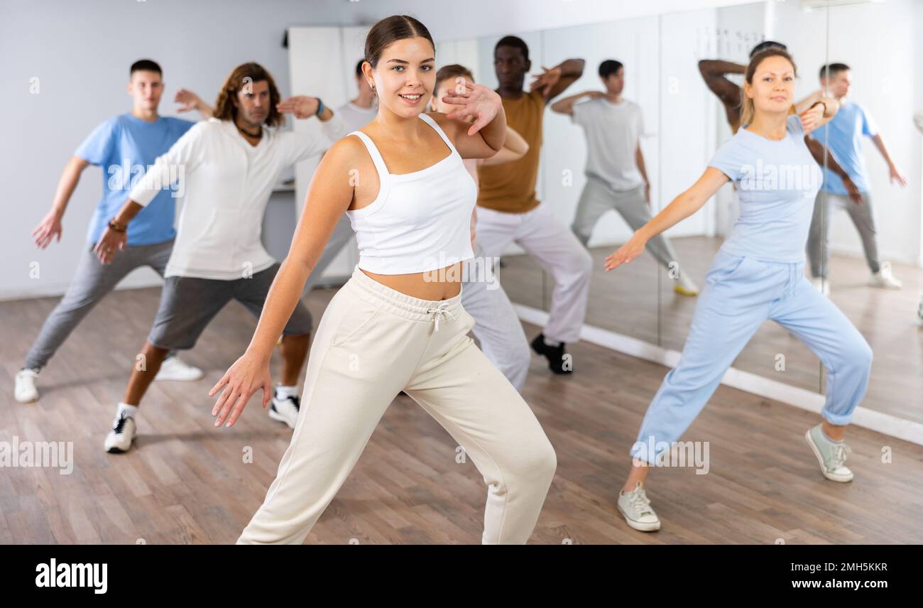 Group of different people rehearsing dance in dance studio Stock Photo ...