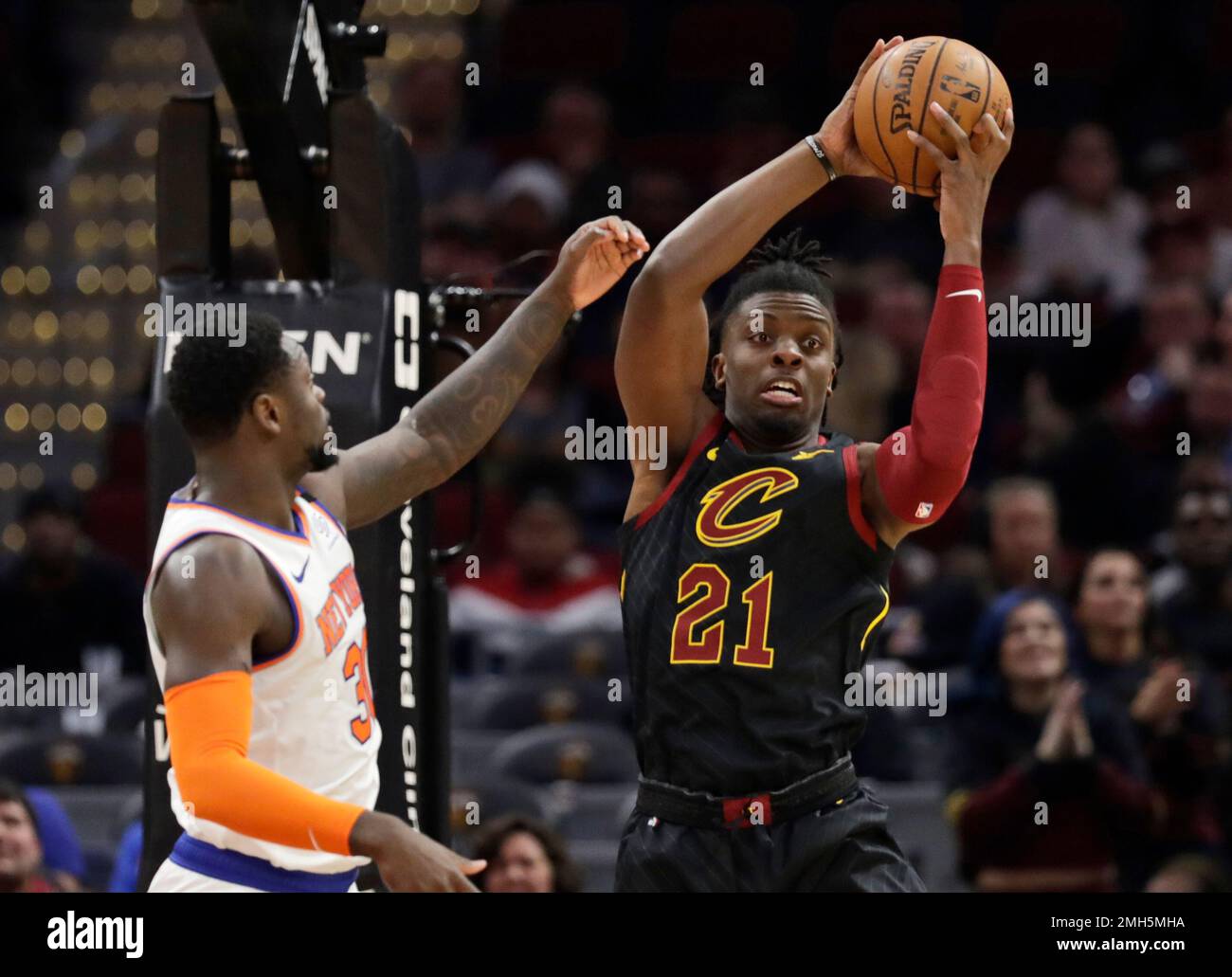 Cleveland Cavaliers' Tyler Cook (21) looks to pass against New York ...