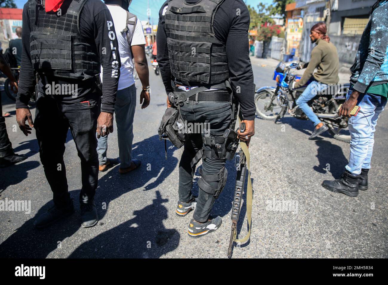 Armed police officers stands with his weapons drawn during a protest to ...