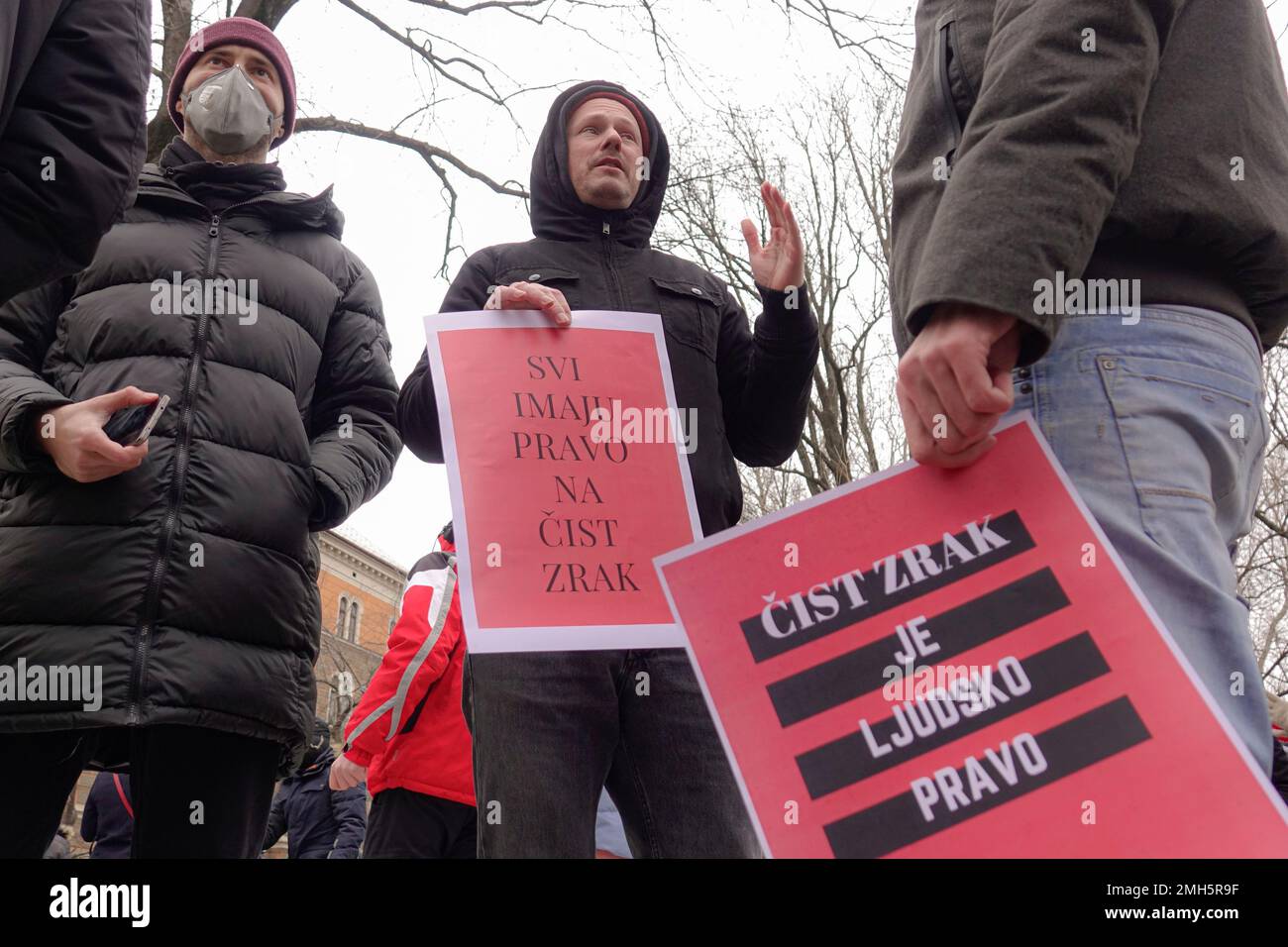 People holding banners that read "Clean air is a human right" and ...