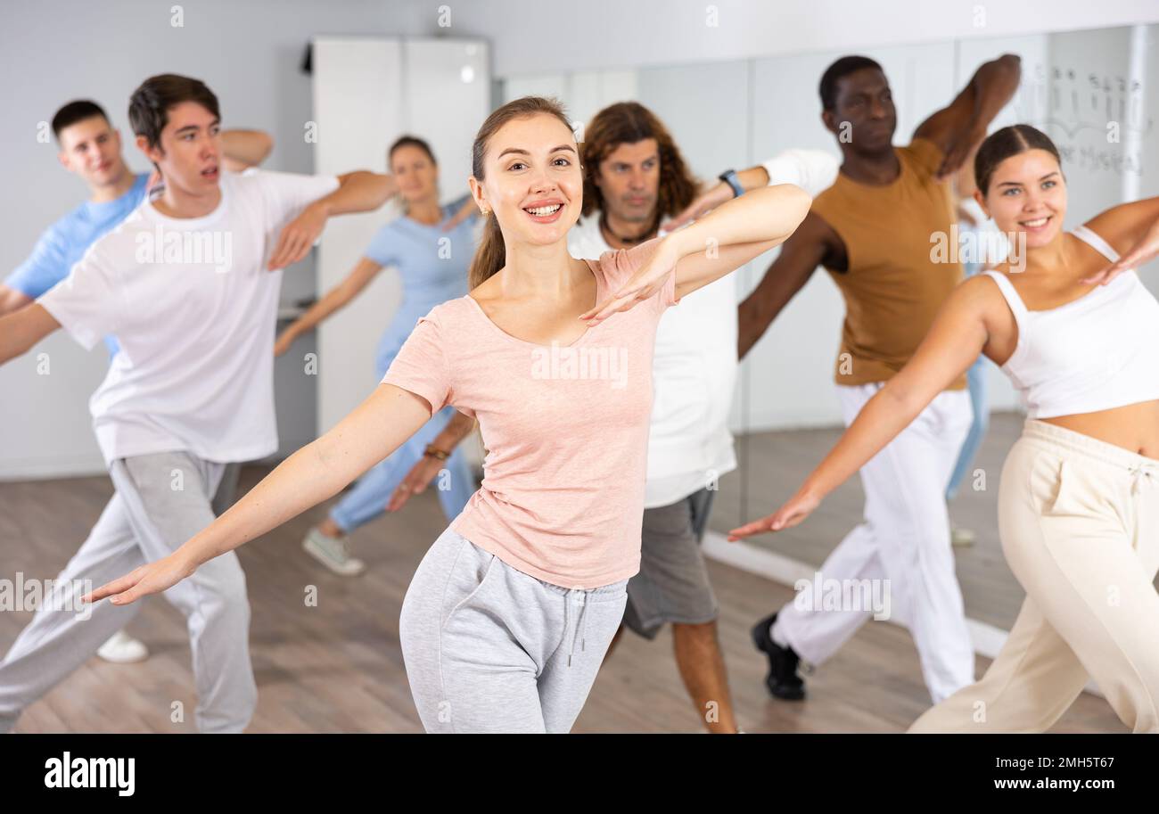 Happy active energetic multiracial dancers of different ages dancing ...