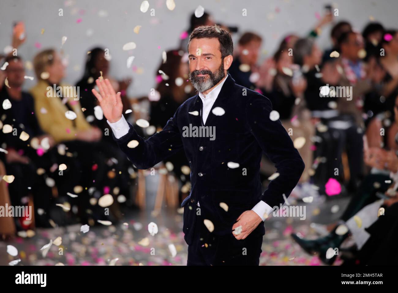 Fashion designer Daniel Roseberry waves after the presentation of ...