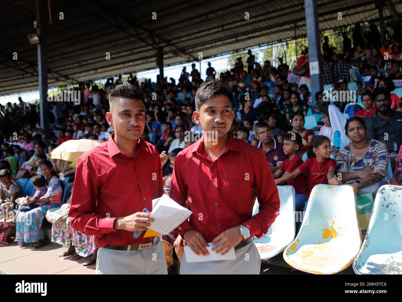 Sri Lankan twins pose as they participate in an event organized to ...