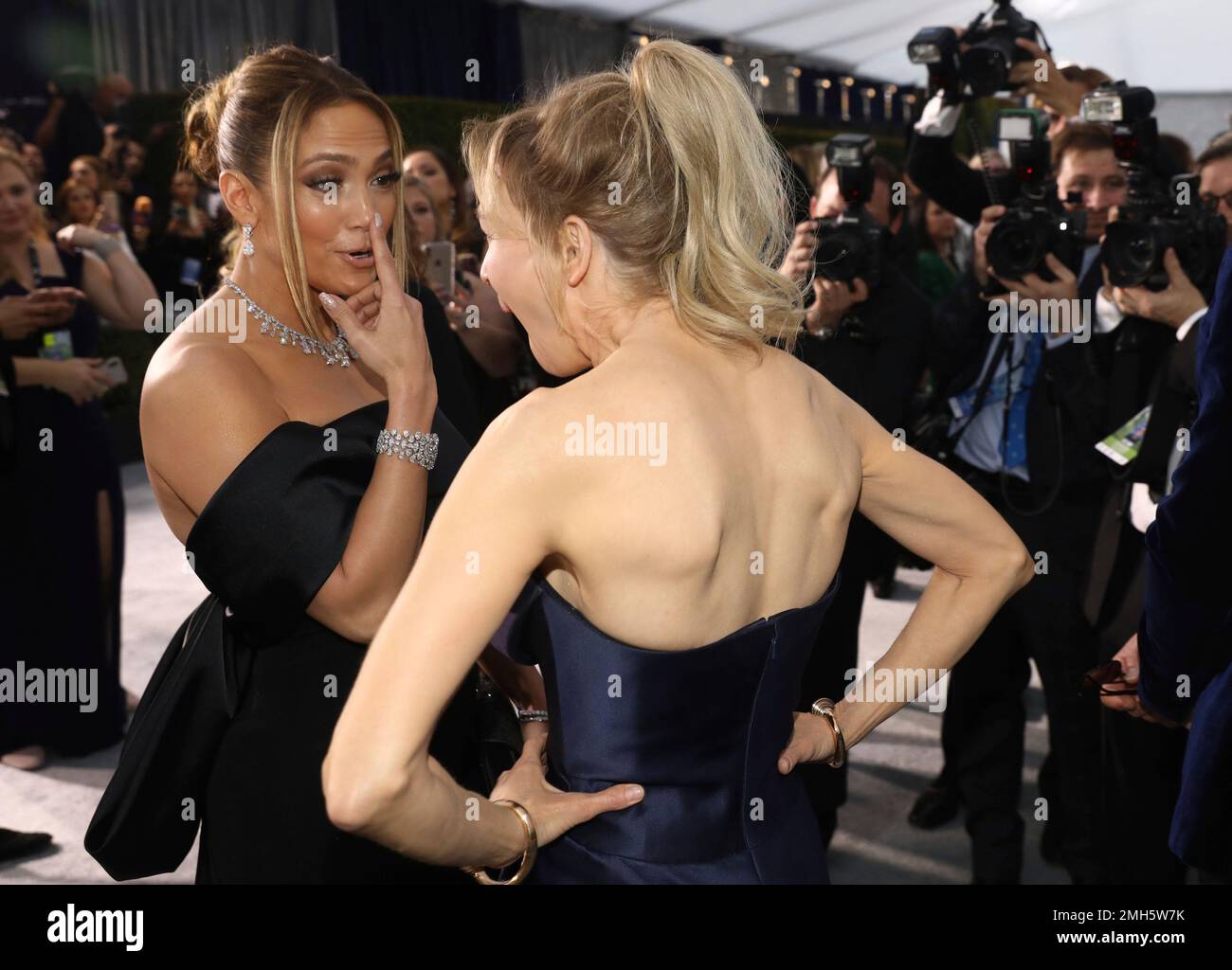 Jennifer Lopez, left, and Renee Zellweger arrive at the 26th annual ...