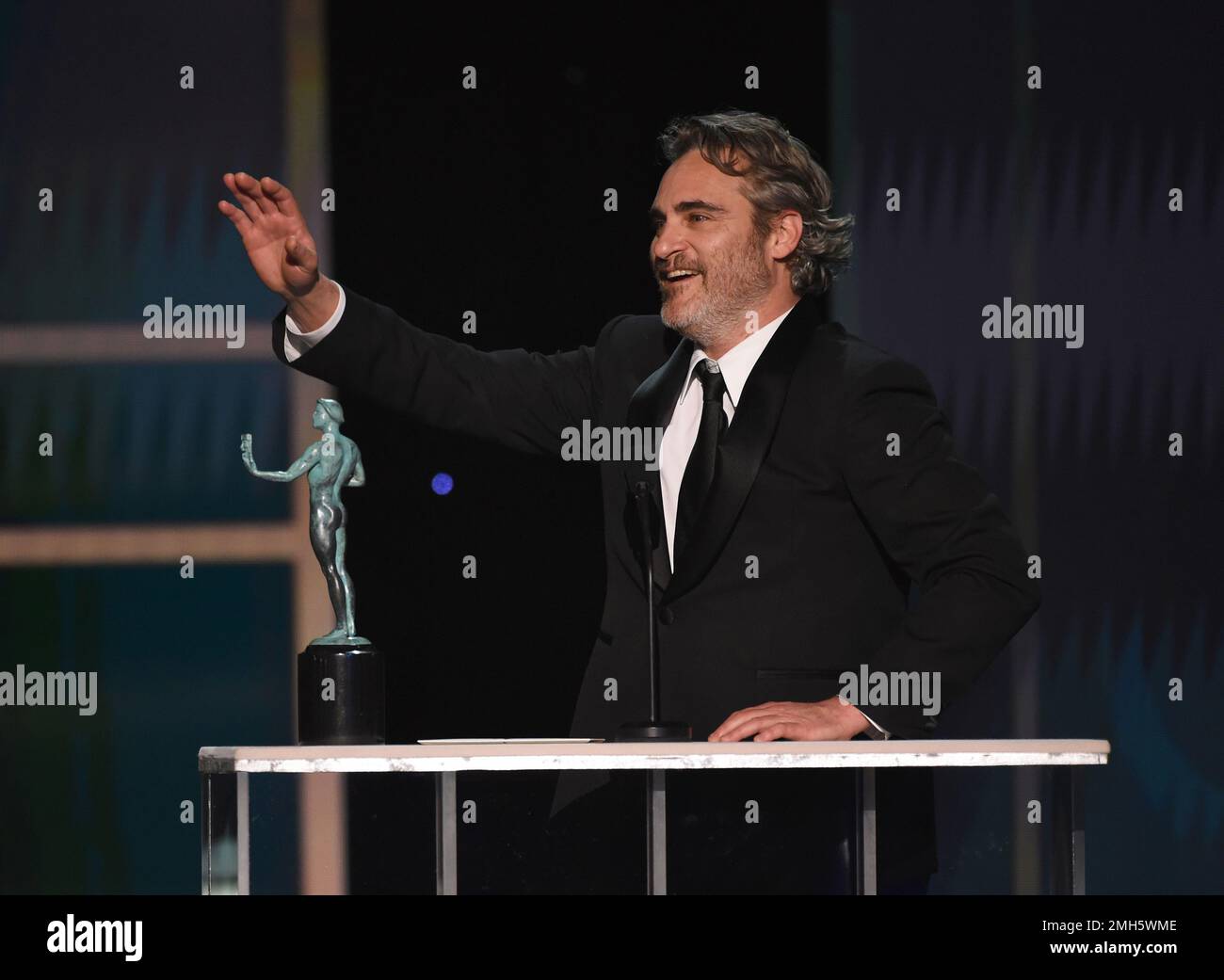 Joaquin Phoenix accepts the award for outstanding performance by a male ...
