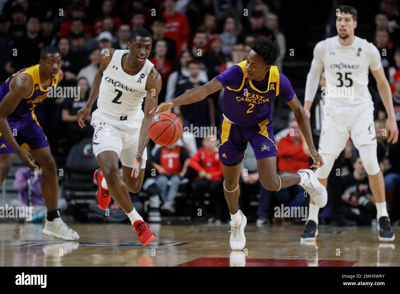 East Carolina's Tristen Newton, right, and Cincinnati's Keith Williams ...