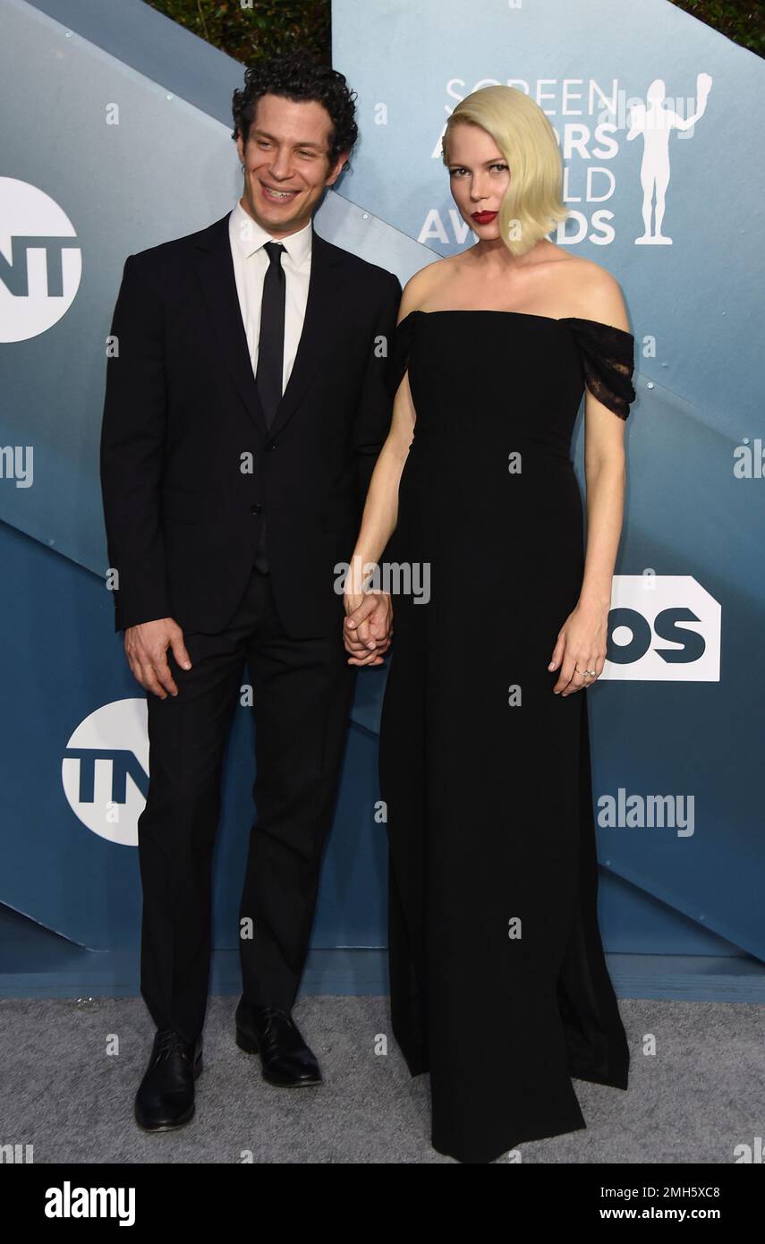 Thomas Kail, left, and Michelle Williams arrive at the 26th annual ...