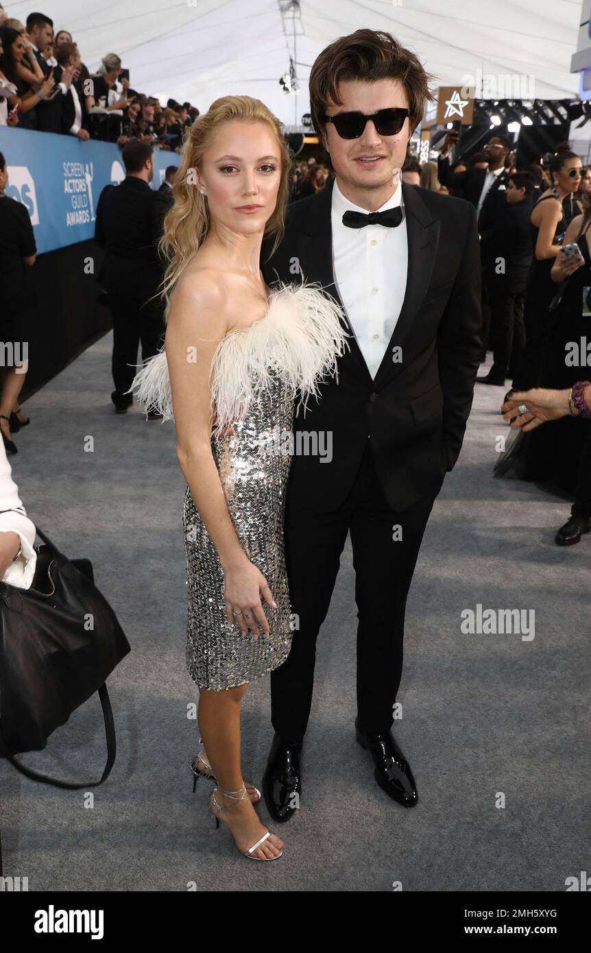 Maika Monroe, left, and Joe Keery arrive at the 26th annual Screen ...