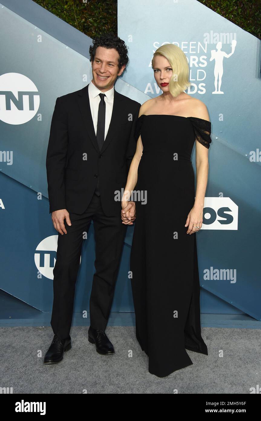Thomas Kail, left, and Michelle Williams arrive at the 26th annual ...