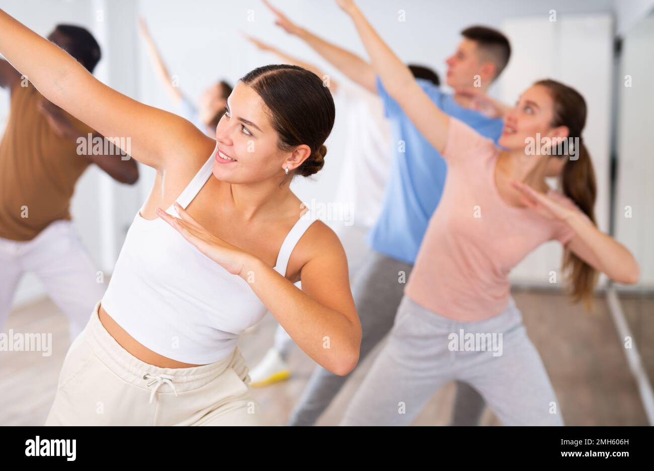 Happy active energetic multiracial dancers of different ages dancing ...