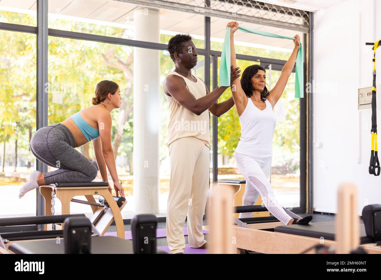 Professional African American man instructor controlling woman ...