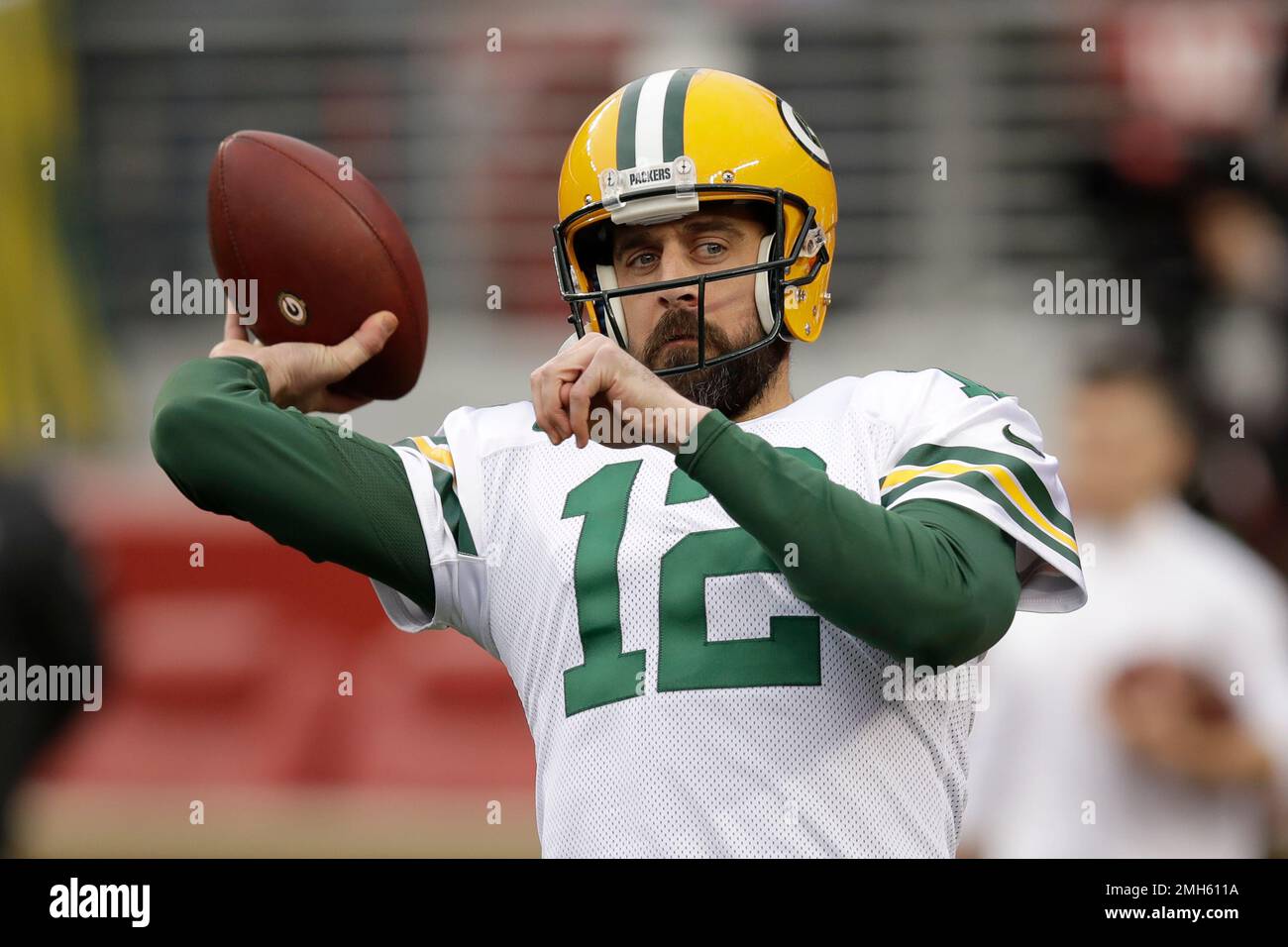 Green Bay Packers quarterback Aaron Rodgers (12) warms up before the ...