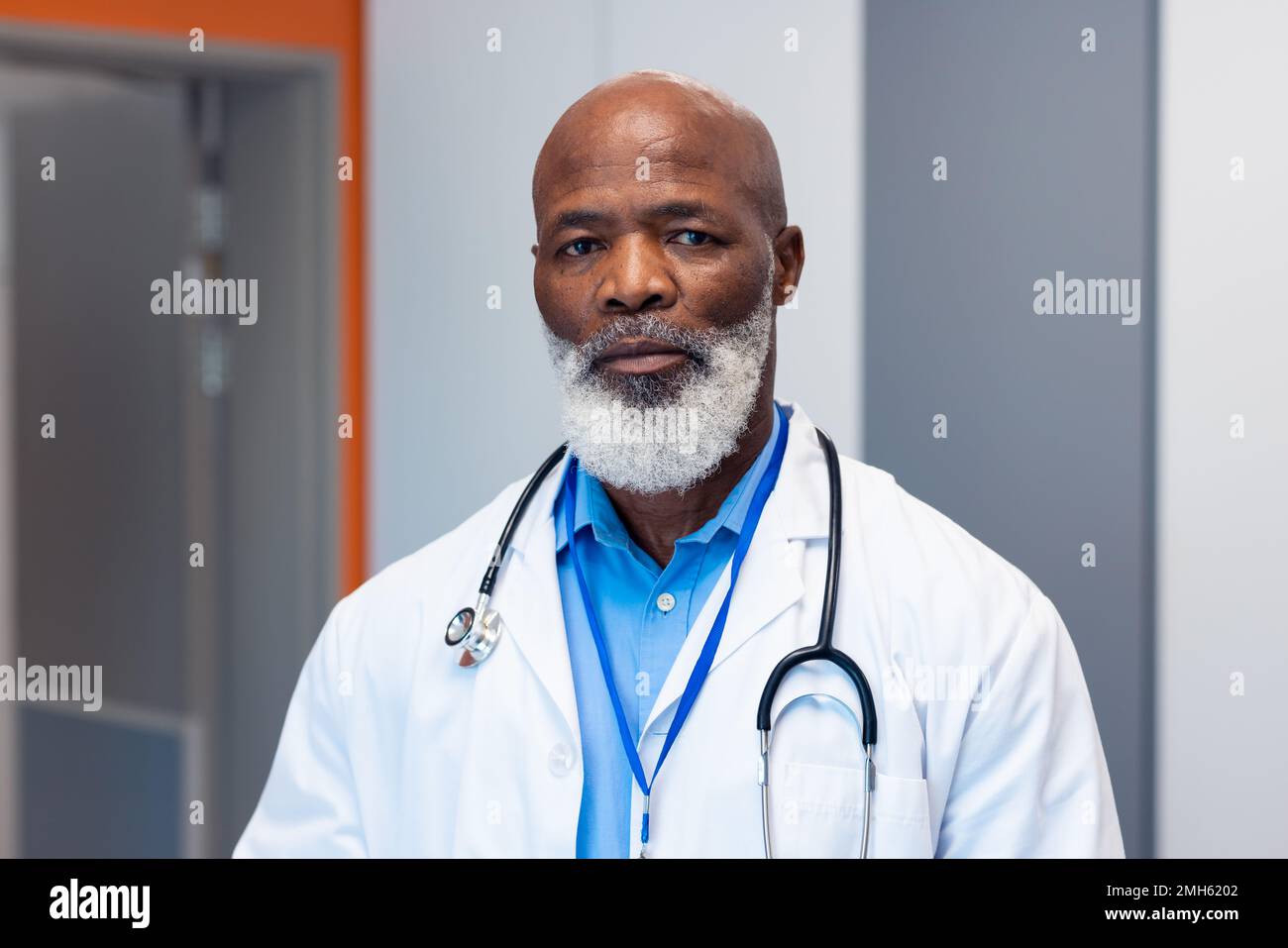 Portrait of serious african american senior male doctor in hospital ...