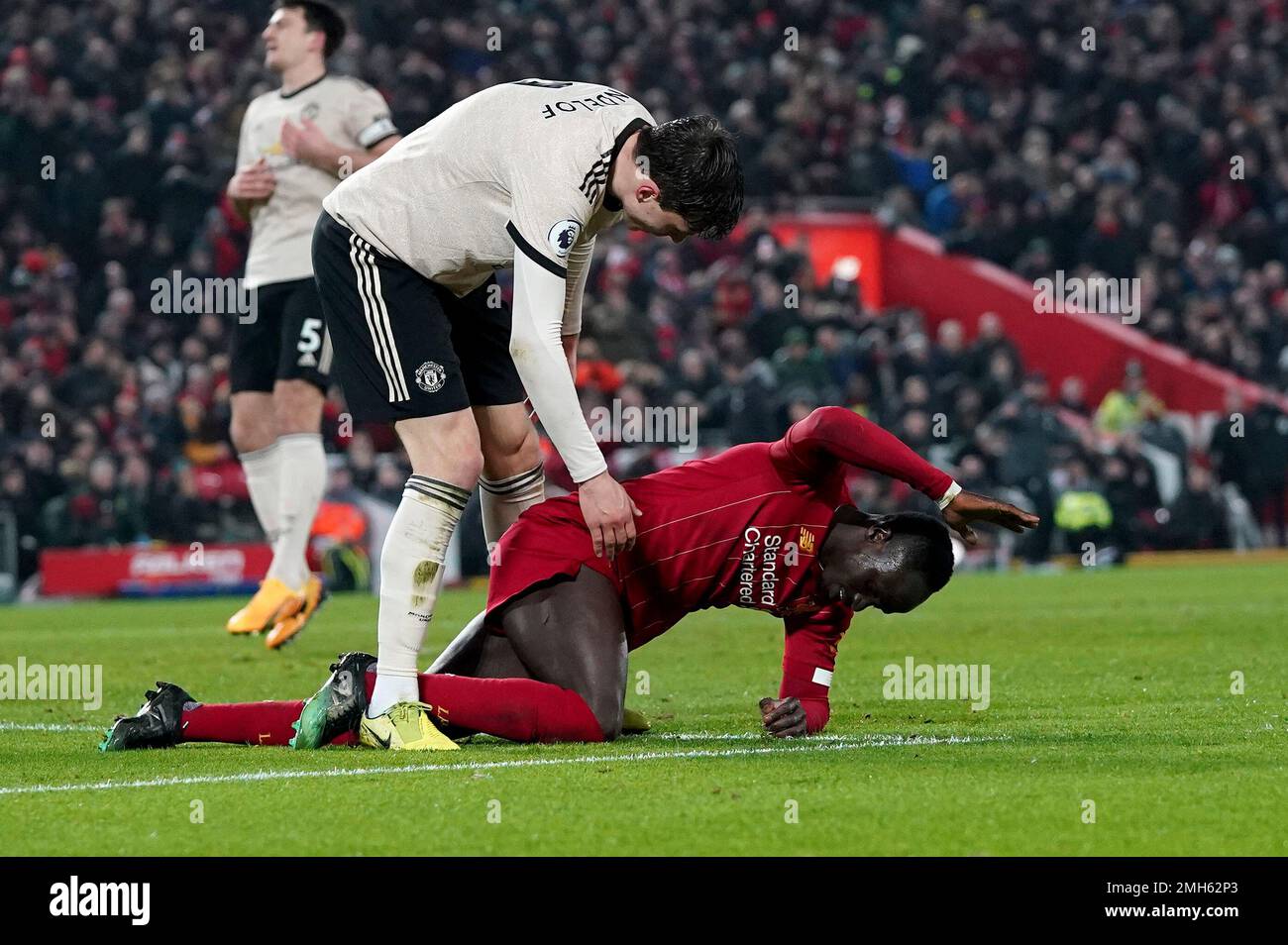 Liverpool's Sadio Mane, bottom, reacts after missing an opportunity ...