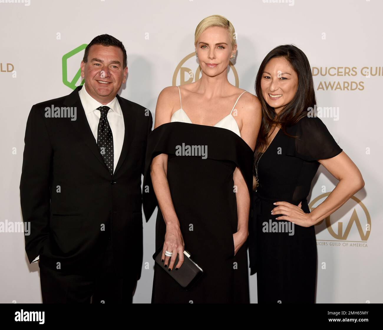 A.J. Dix, from left, Charlize Theron and Beth Kono arrive at the 2020 ...