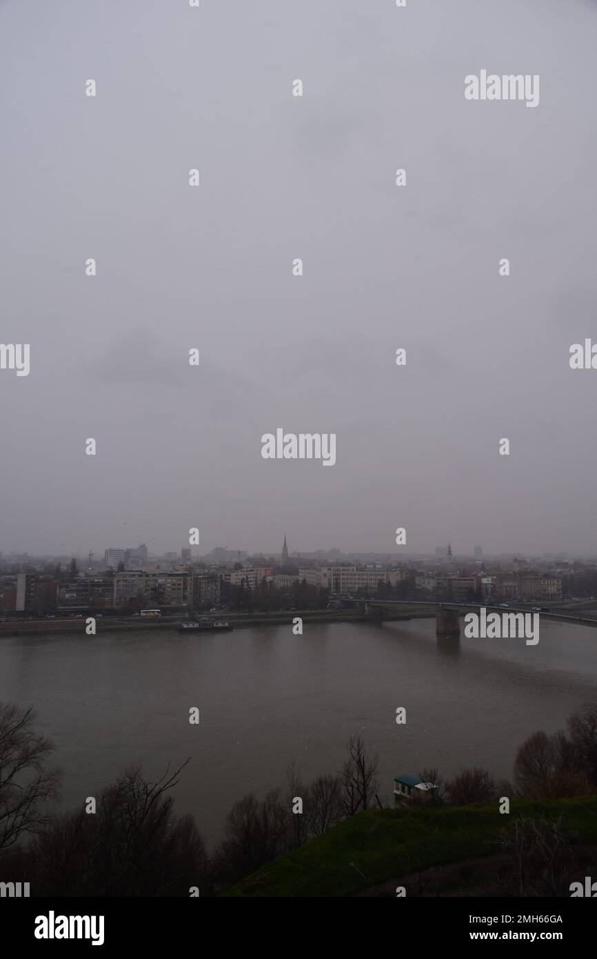 View of Novi Sad city panorama over the Danube river on a foggy, rainy ...