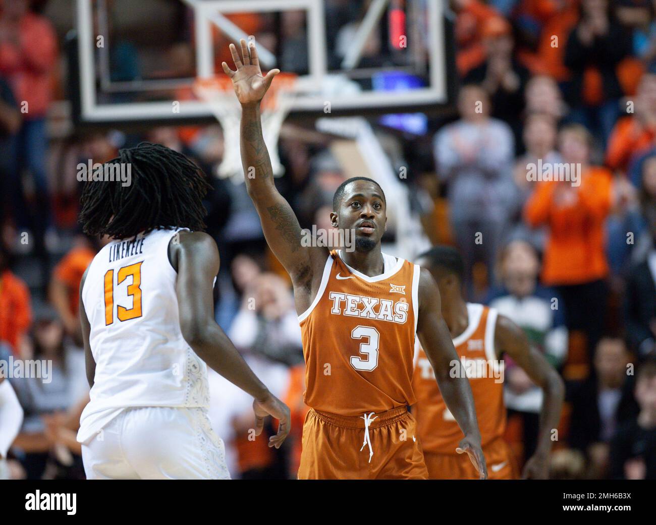 Texas guard Courtney Ramey (3) raises his hand during an NCAA college ...