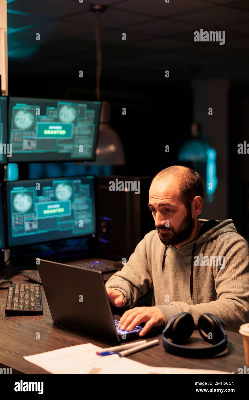 Dangerous hacker breaking into data servers at office, using virus to infect computer and system ...