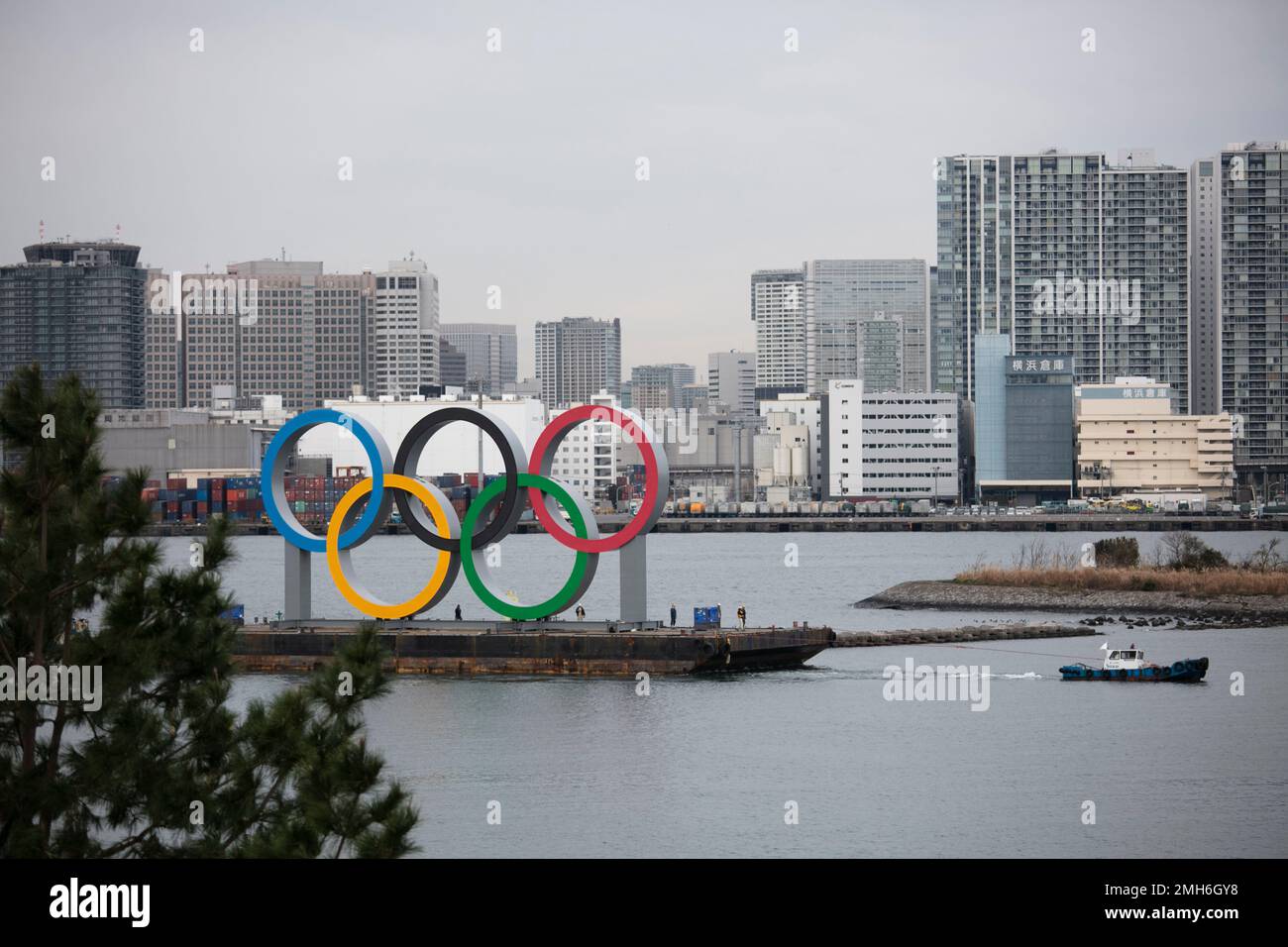 A barge carrying the Olympic Rings floats in the water Friday, Jan. 17 ...
