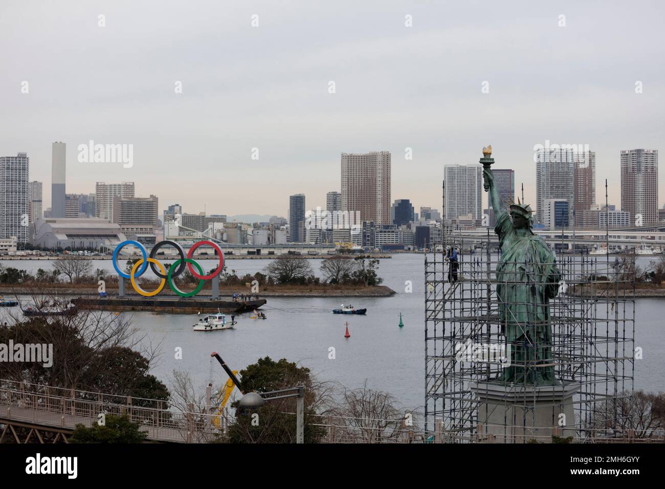 A worker installs scaffolding on the Statue of Liberty replica as a ...