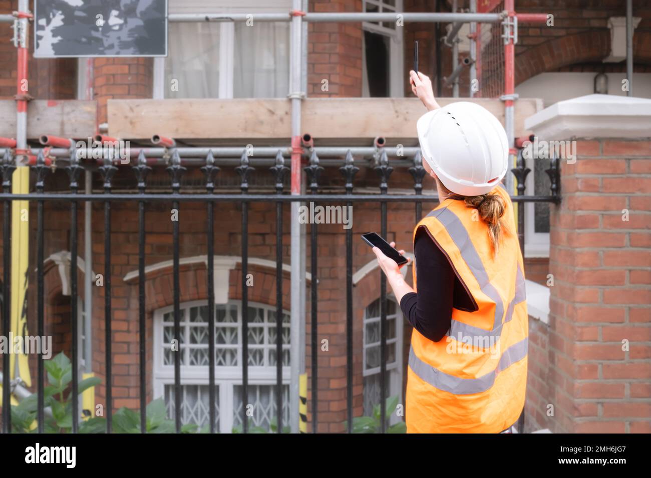 Unrecognizable female civil engineer supervising a construction site ...