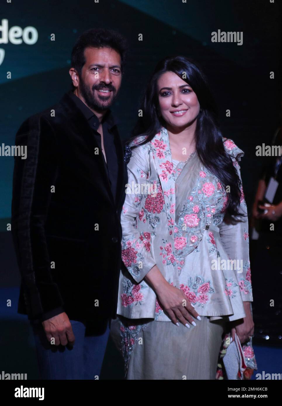 Indian film director Kabir Khan, left, poses for photographs with Mini ...