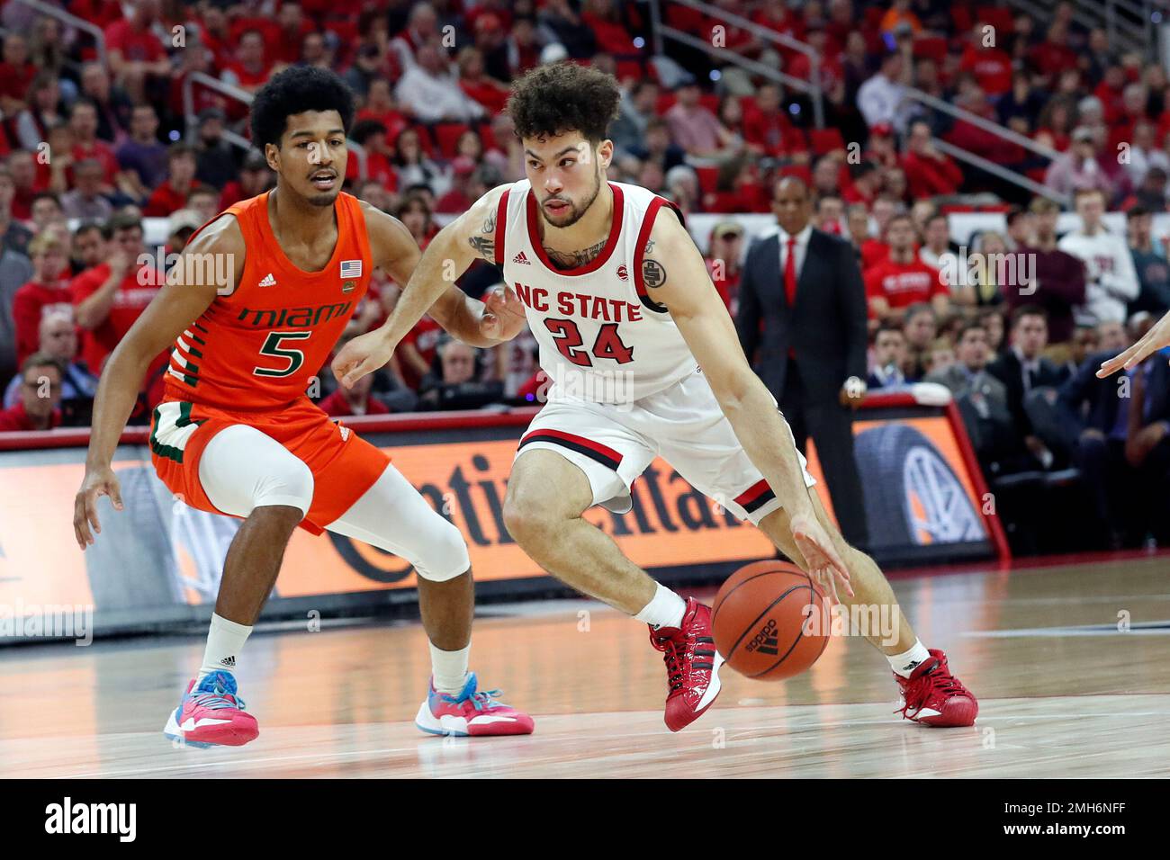 Miami guard Harlond Beverly (5) guards North Carolina State guard Devon ...