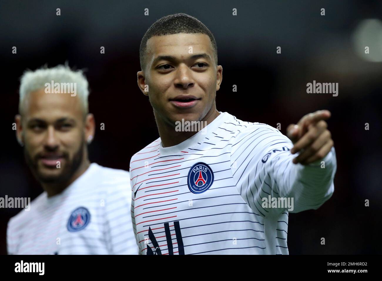 PSG's Kylian Mbappe points his finger during warmup ahead of the French ...