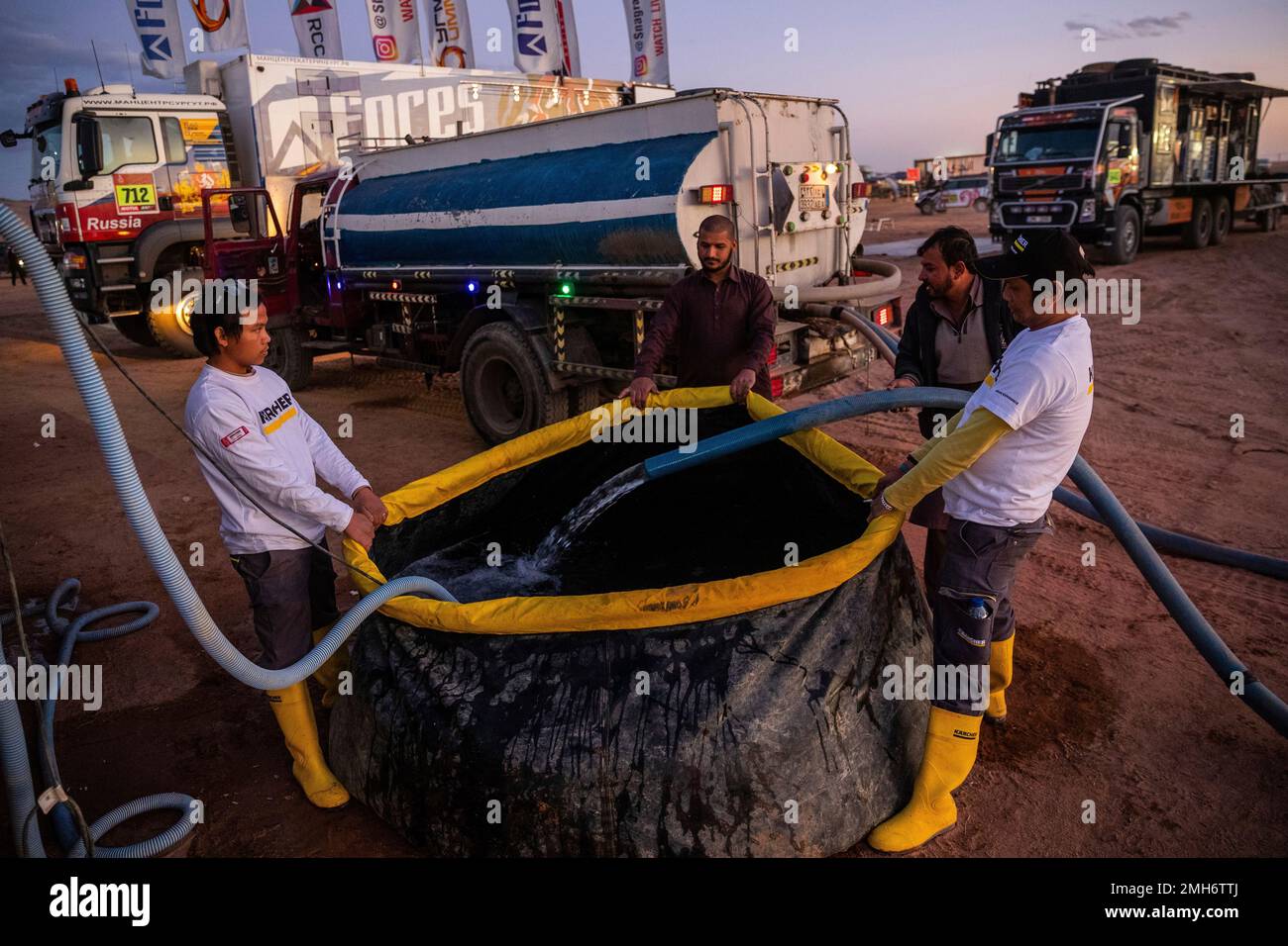 In this Thursday, Jan. 9, 2020 photo, Karcher staffers fill a tank with ...