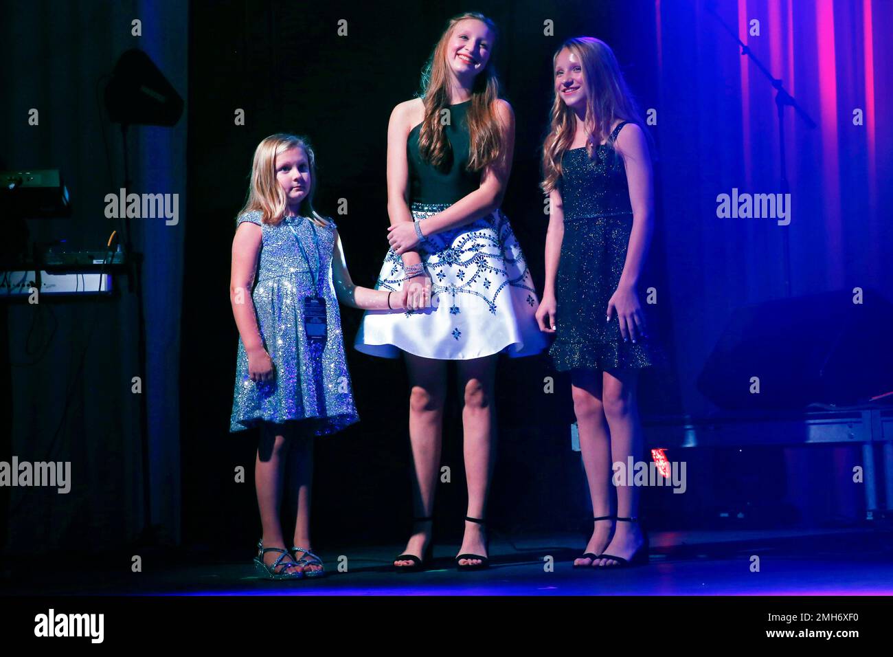 Maddie Reeves, left, and her sisters, Tyler, center and Emma watch ...