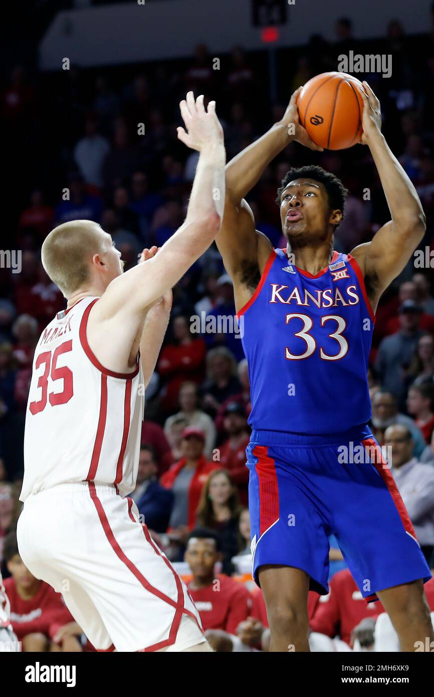 Kansas' David McCormack (33) shoots as Oklahoma's Brady Manek (35 ...