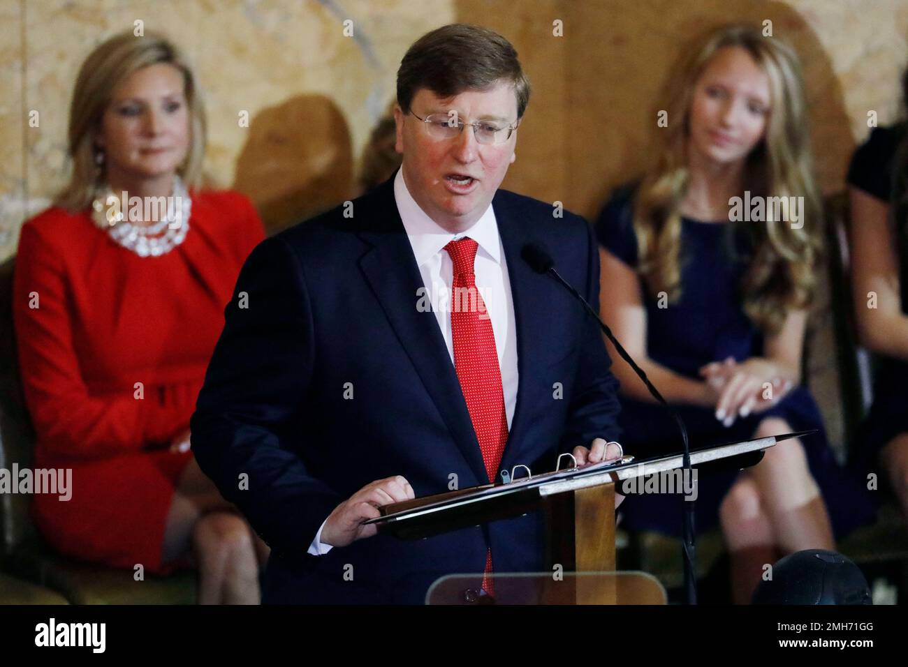 Gov. Tate Reeves, center, delivers his address after being sworn into ...