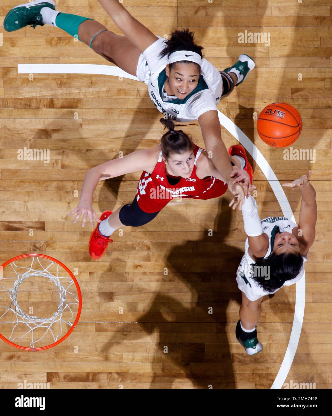 Michigan State's Taiyier Parks, top, Wisconsin's Julie Pospisilova ...