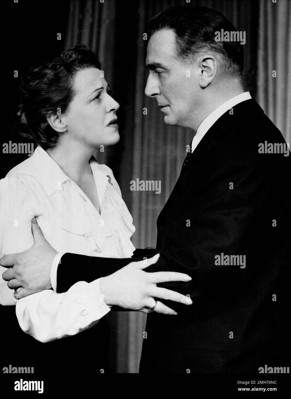 Actors Paul Lukas and Mady Christians appear in a tense moment in the ...