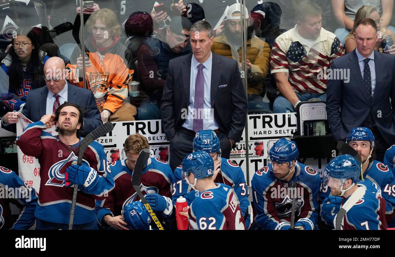 Colorado Avalanche head coach Jared Bednar, center, is flanked by ...