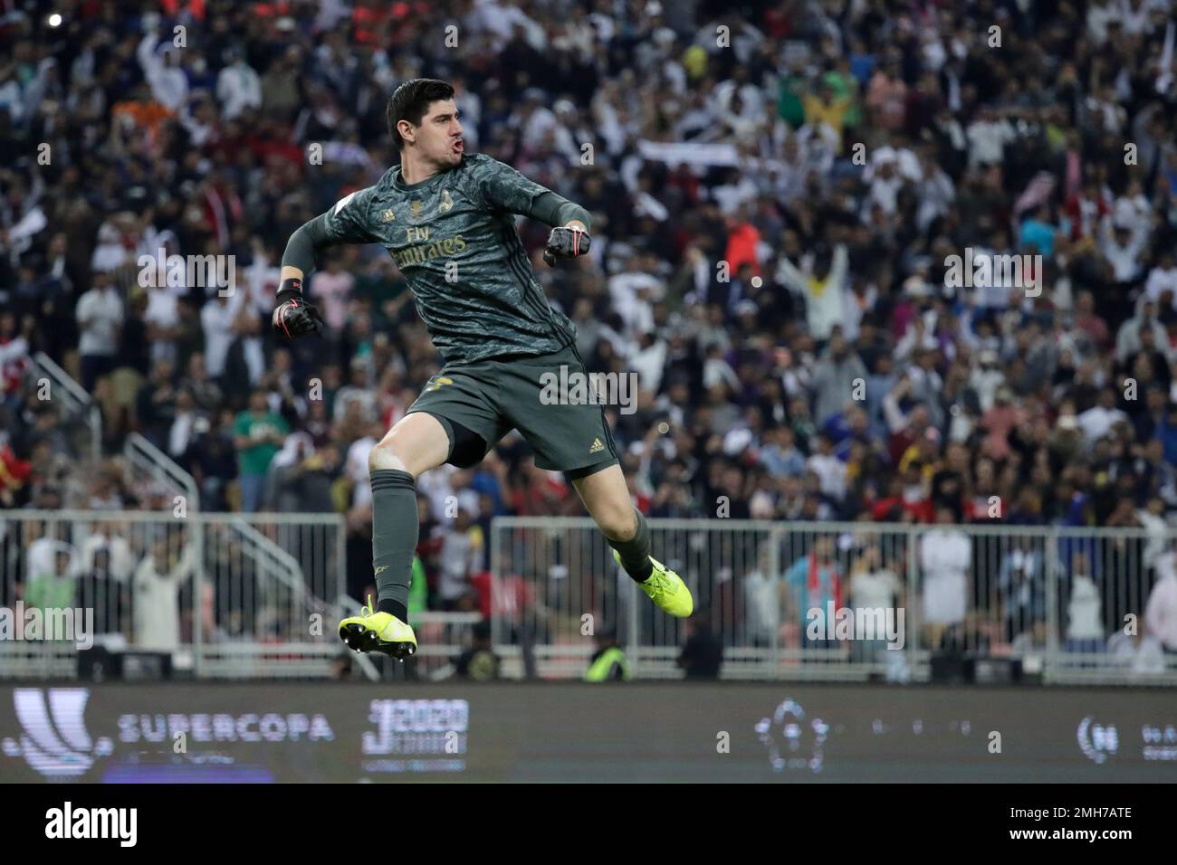 Real Madrid's goalkeeper Thibaut Courtois celebrates saving a penalty ...