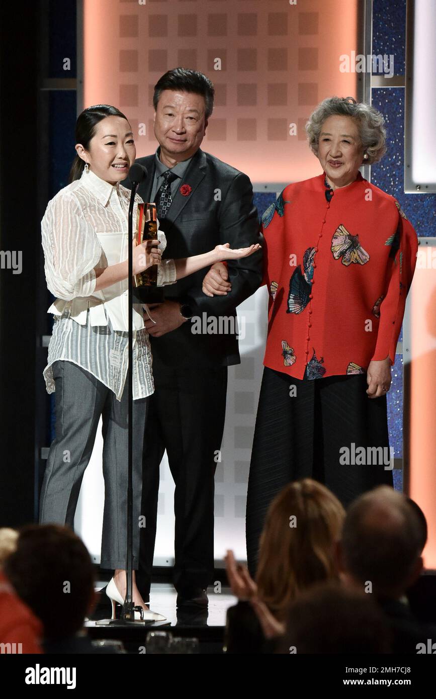 Lulu Wang, from left, Tzi Ma and Zhao Shuzhen accept the award for Best Intergenerational Film ...
