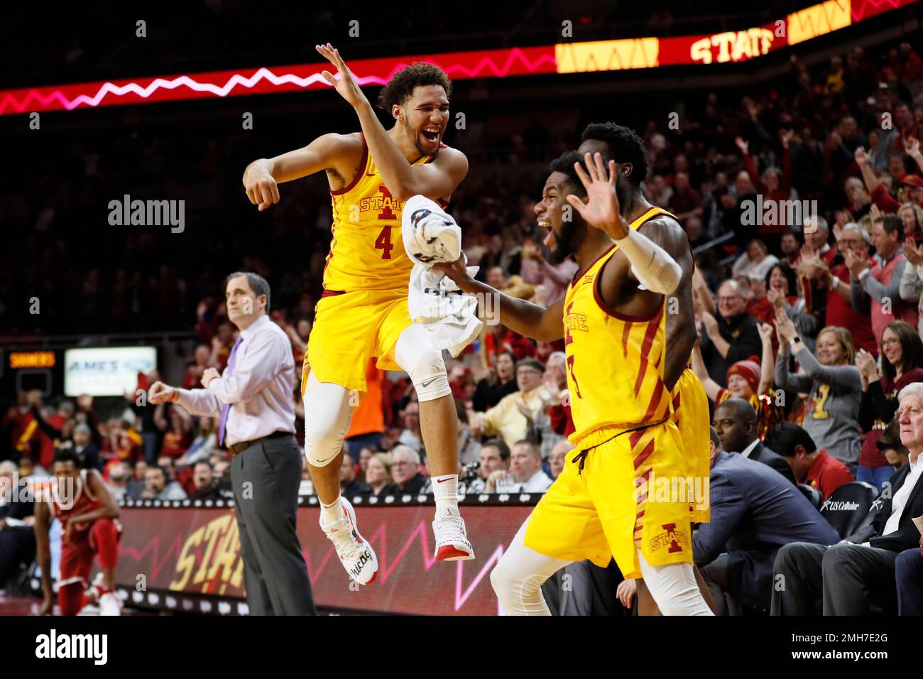 Iowa State forward George Conditt IV (4) celebrates with teammates on ...