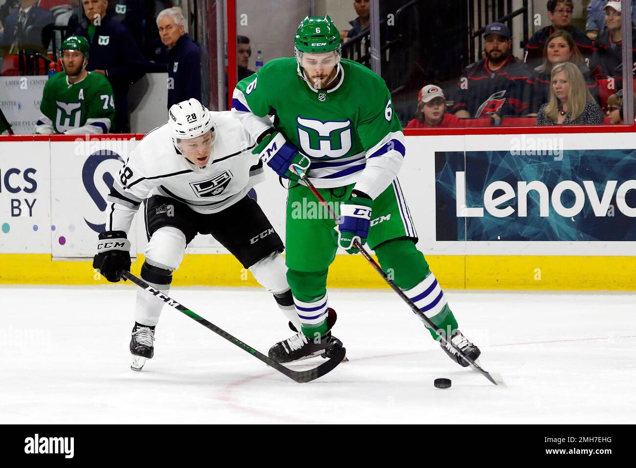 Carolina Hurricanes' Joel Edmundson (6) protects the puck from Los ...