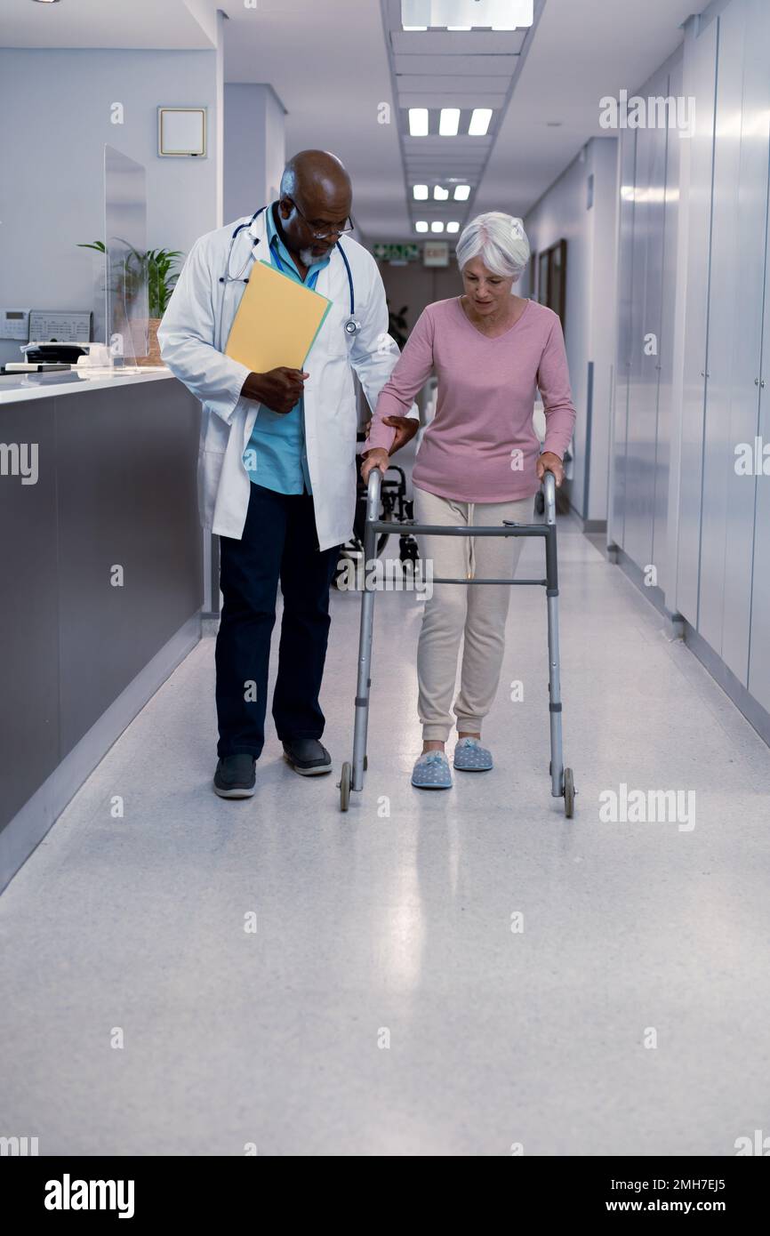 Male doctor walking corridor hi-res stock photography and images - Alamy