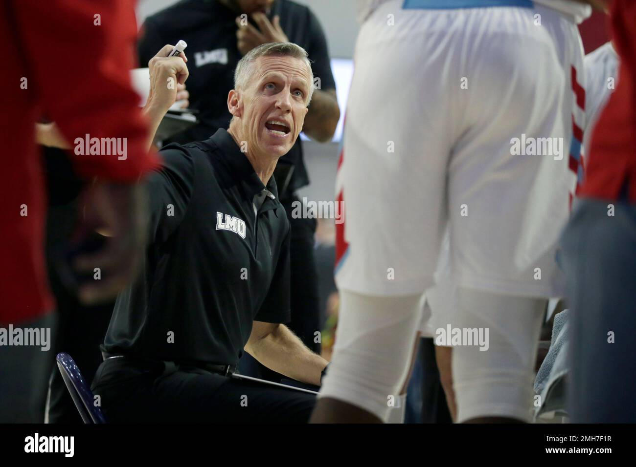 Loyola Marymount head coach Mike Dunlap talks to his player during a ...