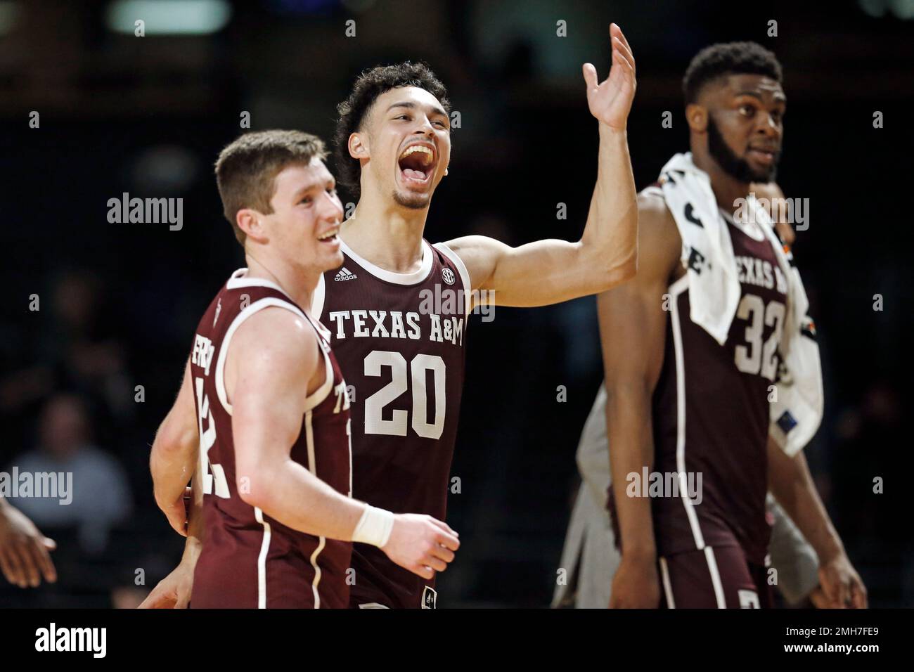 Texas A&M guard Andre Gordon (20) and Mark French (12) celebrate as ...