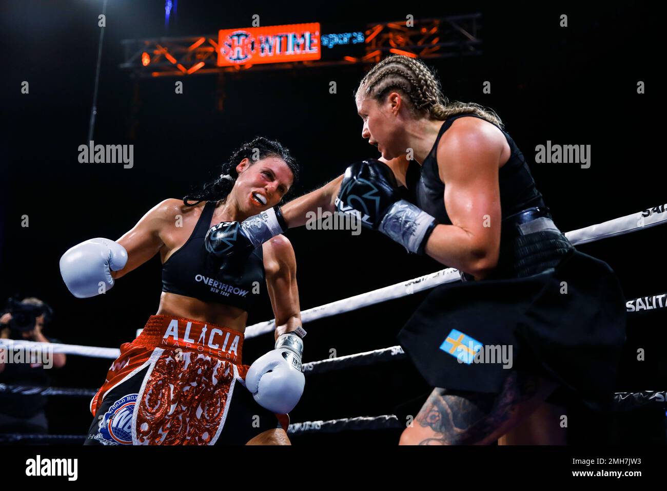 Elin Cederroos, right, throws a right at Alicia Napoleon-Espinosa ...