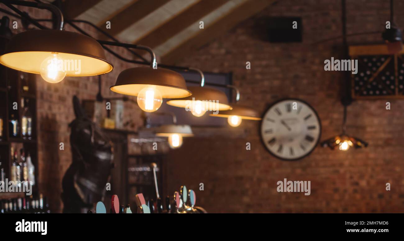 Image of traditional pub with lamps and brick wall Stock Photo - Alamy