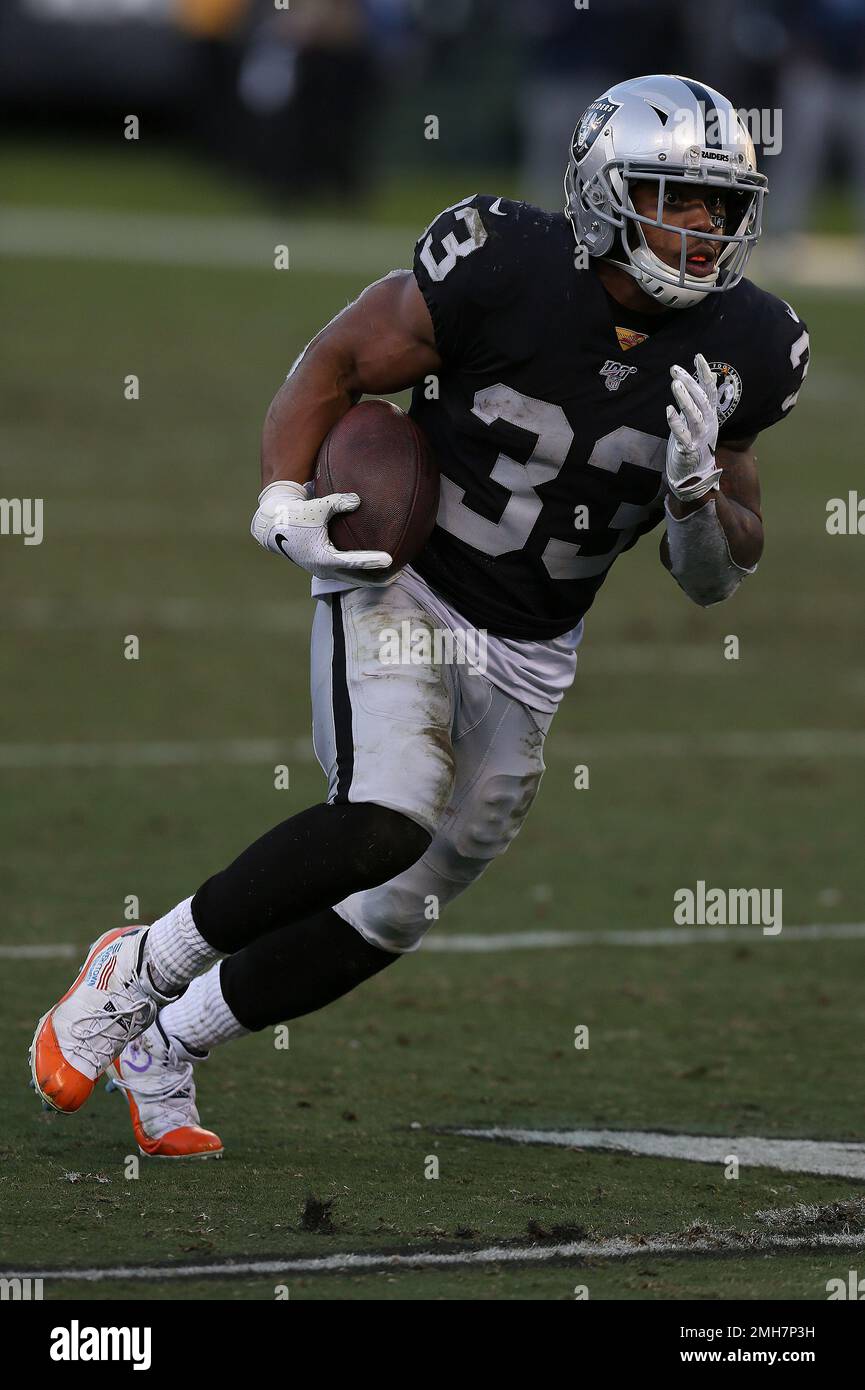 Raiders running back DeAndre Washington runs the ball during the ...