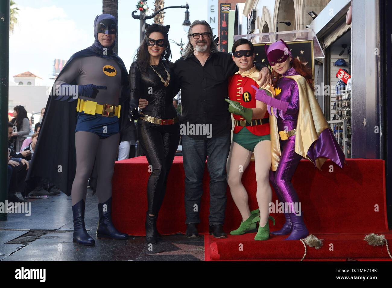 Batman, from left, Catwoman, Robert Carradine, Robin and Riddler pose ...